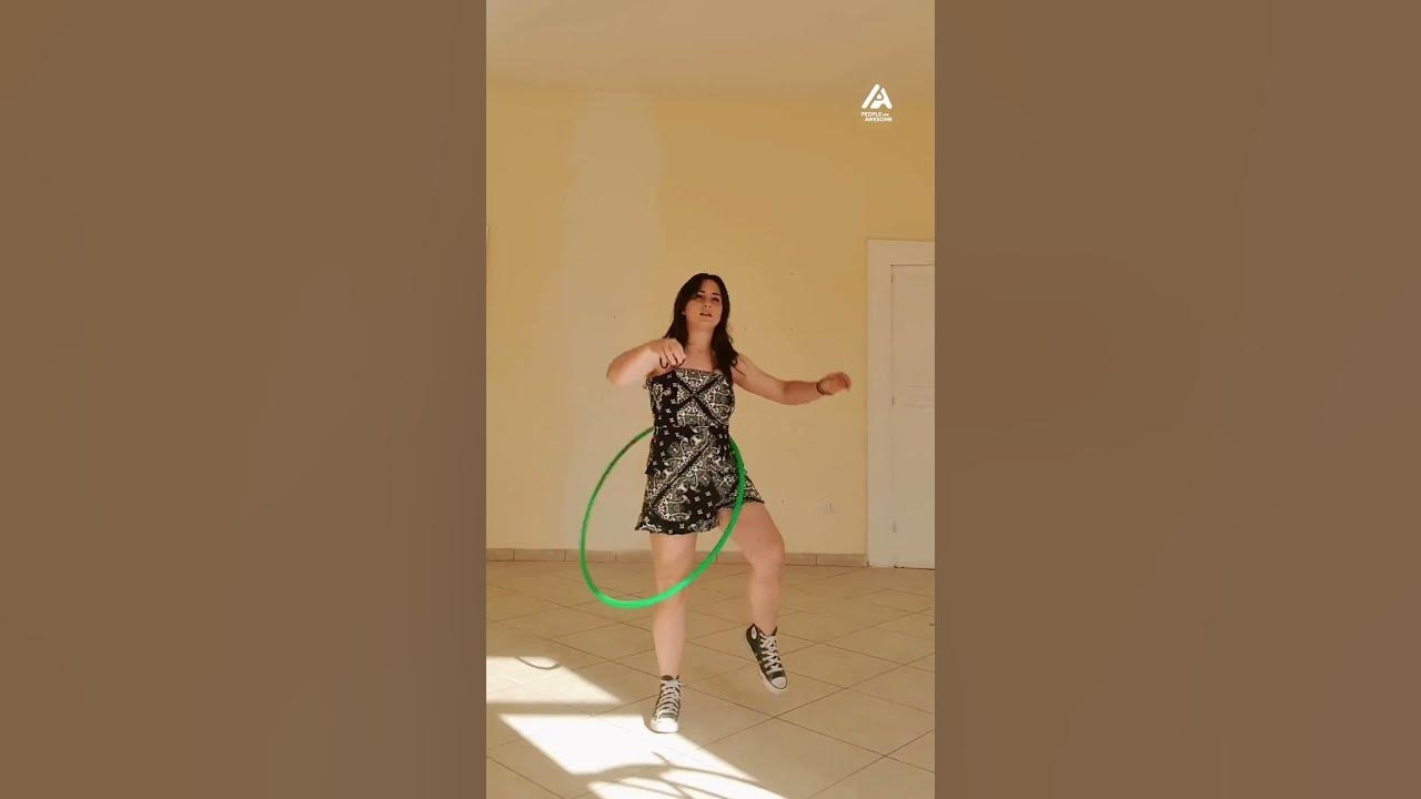Woman Performs Tricks With Hoop While Practicing Amazing Balance - Mover.uz